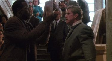 Garber wearing eye of providence at end of Predator 2